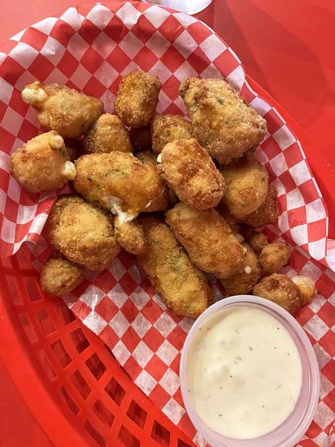 Golden, crispy cheese curds that squeak when you bite them, proving Wisconsin knows exactly what it's doing.