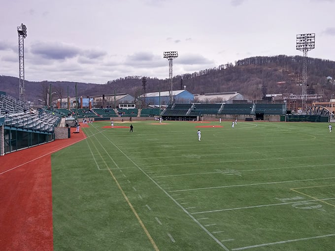 A baseball stadium nestled against rolling hills makes summer evenings feel like scenes from a nostalgic American movie.