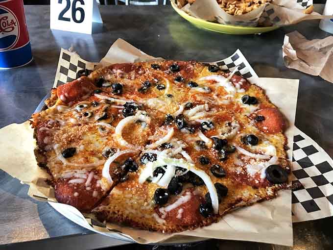 When pizza meets the junkyard aesthetic, beautiful things happen on a checkered paper liner.