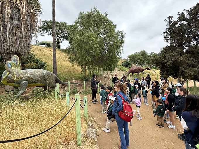 Leading a group of excited kids through dinosaur territory: basically Jurassic Park without the liability waivers.