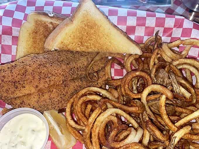 Golden curly fries and perfectly toasted bread prove that sometimes the sides steal the show from the main event.