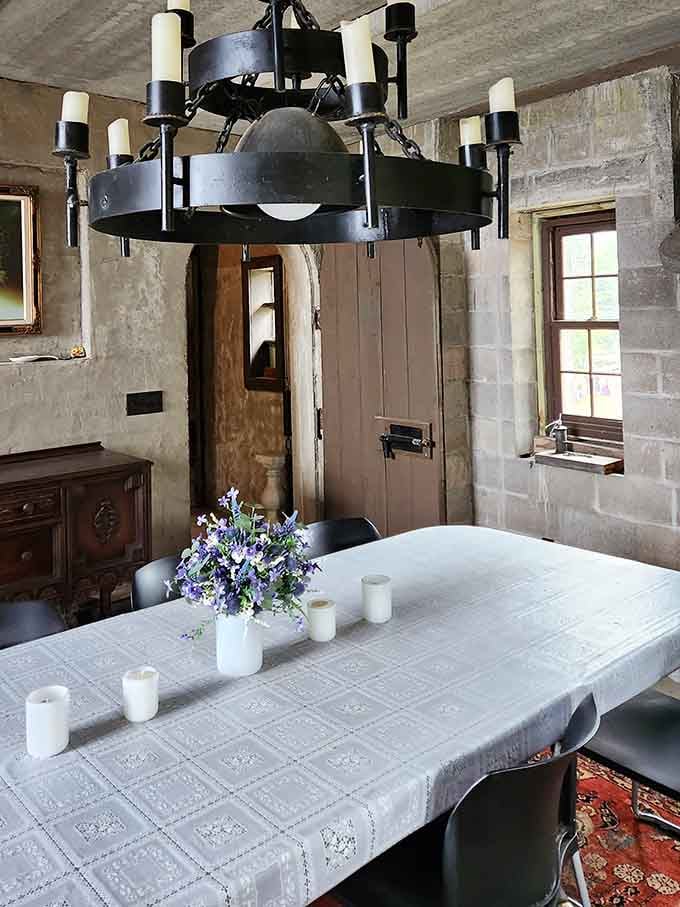 Candlelit chandeliers and stone walls transform dinner into a feast worthy of King Arthur's round table.