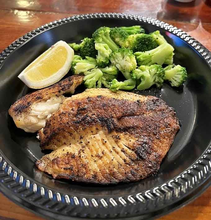 Perfectly seasoned tilapia with bright green broccoli proves that simple preparations often deliver the most spectacular results.