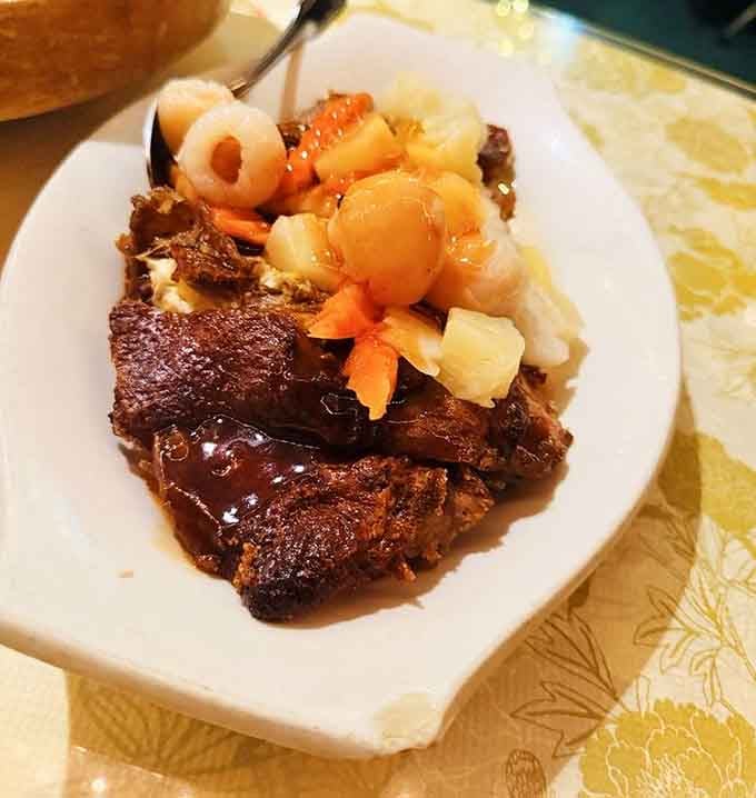 Lychee pineapple duck combines sweet tropical fruit with rich meat in a way that shouldn't work but absolutely does.