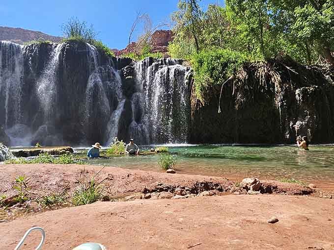 Nothing says "we made it" quite like standing in front of a waterfall that required serious commitment.