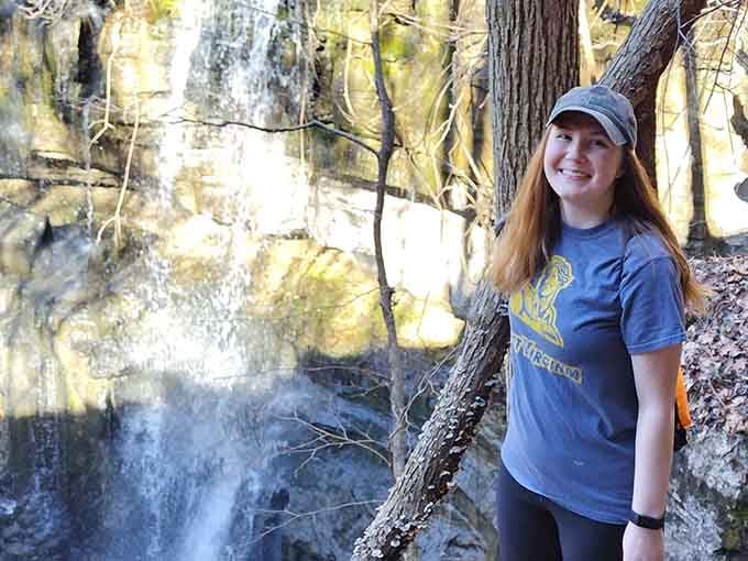 That smile says it all: finding a hidden waterfall beats scrolling through social media any day.
