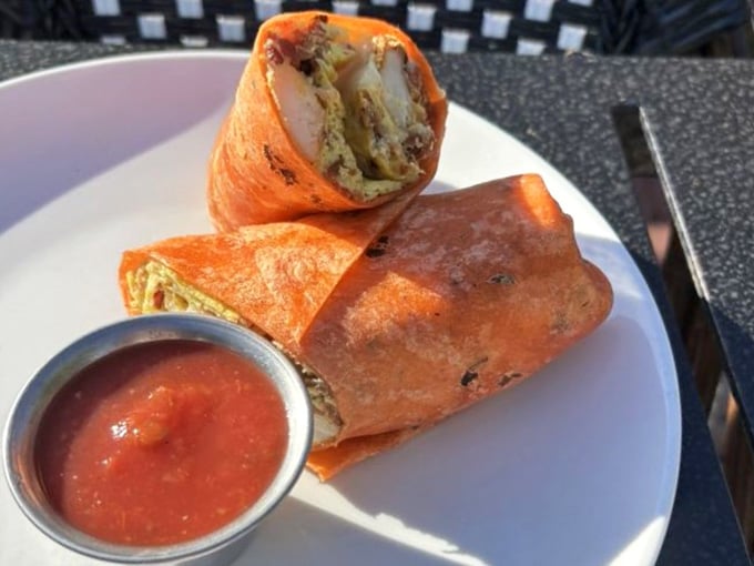 A burrito wrapped in that gorgeous orange tortilla proves that presentation absolutely matters, even for handheld food.