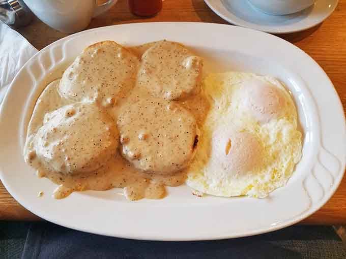 Biscuits, gravy, and a perfectly cooked egg. The holy trinity of morning comfort on one plate.