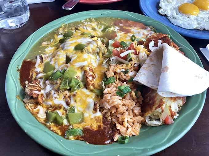 Those tortilla chips have achieved the impossible, staying crispy while soaking up sauce, topped with melted cheese perfection.