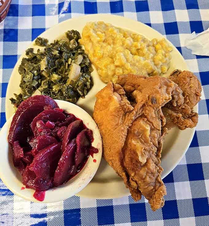 Creamed corn, collard greens, pickled beets, and that glorious chicken. This plate covers all the food groups.