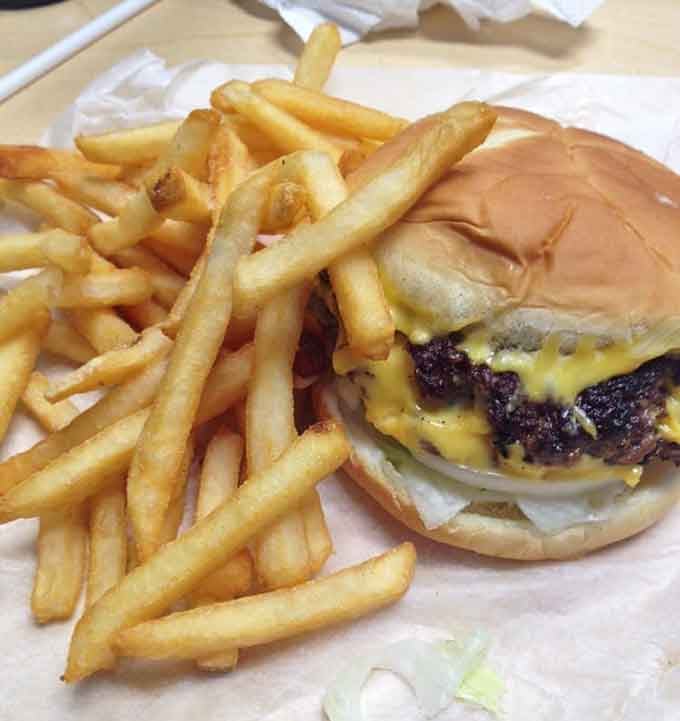 The dynamic duo: a cheeseburger paired with golden fries that could make a grown person weep with joy.