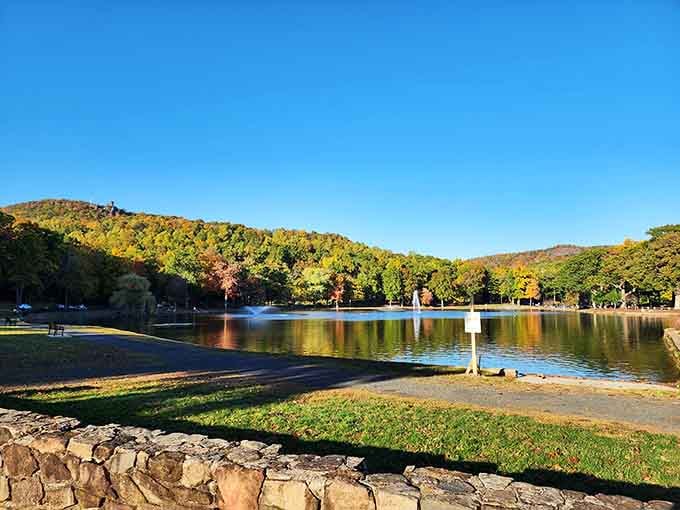 Hubbard Park's mirror lake reflects autumn colors so perfectly, you'll wonder if Mother Nature moonlights as an Instagram influencer.