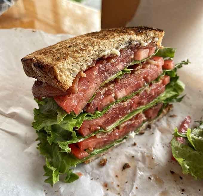 The Triple BLT towers like a delicious skyscraper that requires engineering skills to eat properly.