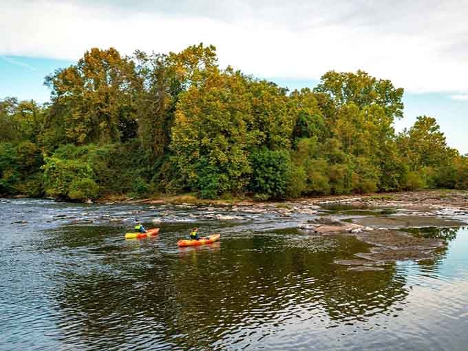 Kayakers glide along the Oconee River, discovering the kind of peaceful adventure that makes you forget your phone exists.
