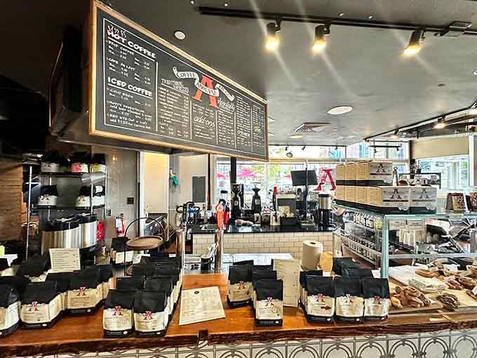 The coffee counter beckons with chalkboard menus promising liquid motivation better than any alarm clock ever invented.