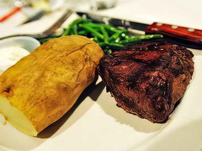 A perfectly cooked steak with all the fixings, because solving murders works up a serious appetite, detective.