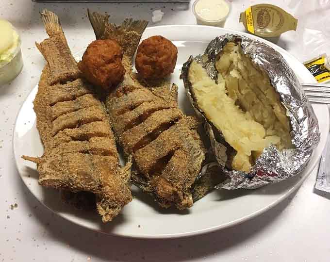That cornmeal crust achieves what lesser restaurants only dream about, crispy perfection protecting tender, flaky fish inside.