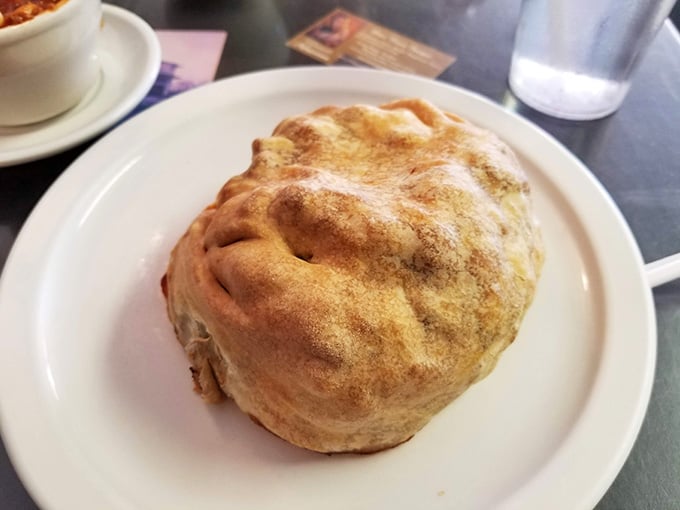 That golden, pillowy pasty is pure Upper Peninsula soul food, and it looks absolutely magnificent on that plate.