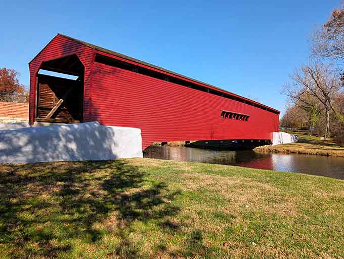 This covered bridge in its brilliant red coat proves that some things never go out of style, just like a good flannel shirt.