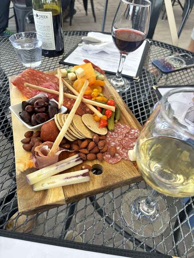 This charcuterie board looks like an edible art installation that somehow tastes even better than it photographs.
