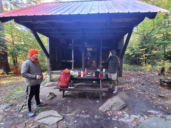 Even the shelters here understand the assignment: rustic charm meets practical outdoor living at its finest.