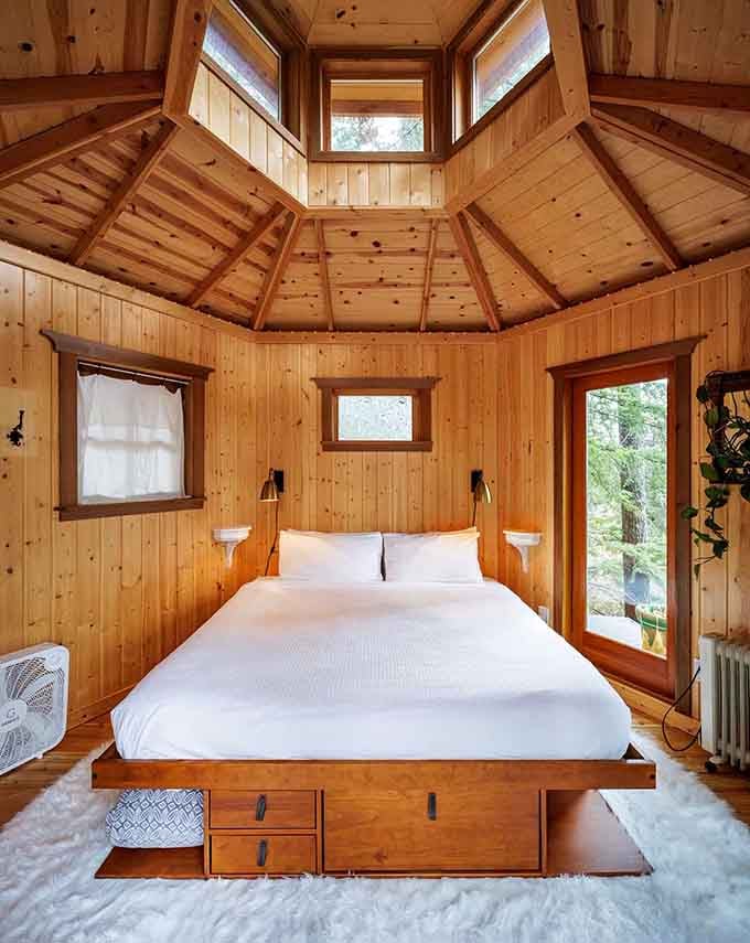 That skylight above the bed means you can stargaze without leaving your covers, which is basically the dream, right?