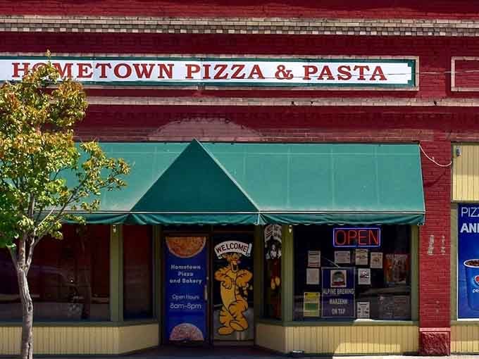 Hometown Pizza & Pasta's red brick facade screams classic Americana, the kind of place where everyone knows the regular orders.