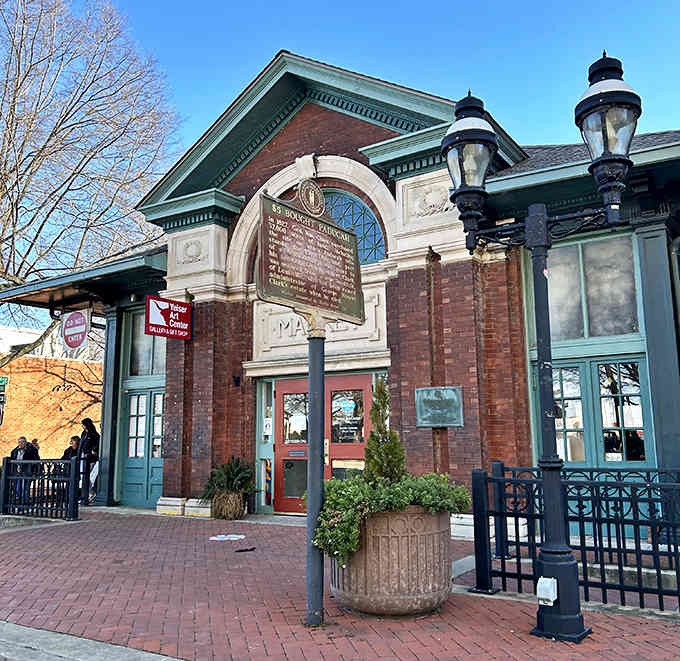 That arched entrance and classical detail hint at the artistic treasures waiting inside these historic walls.