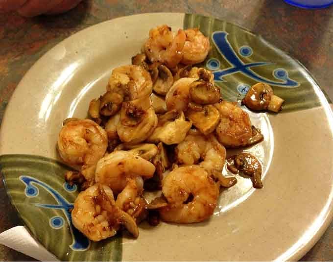 Golden, perfectly seasoned shrimp piled high on a butterfly plate, because even buffet food deserves to look fancy sometimes.