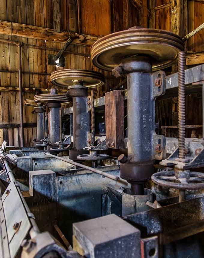 The mill's interior reveals a maze of machinery that would make Rube Goldberg weep with joy.