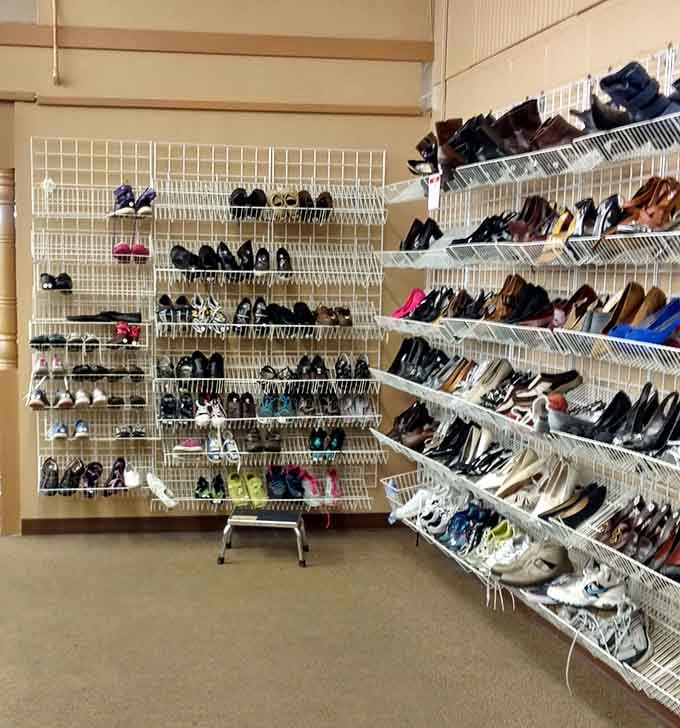 Wall-to-wall footwear organized by size, because life's too short to dig through jumbled shoe bins like some archaeological expedition.