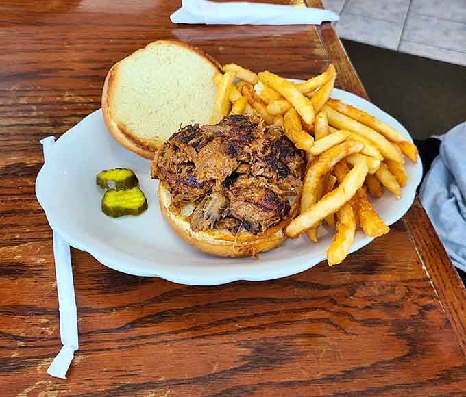 Pulled pork sandwich with fries and pickles, because some combinations are too perfect to mess with or improve.