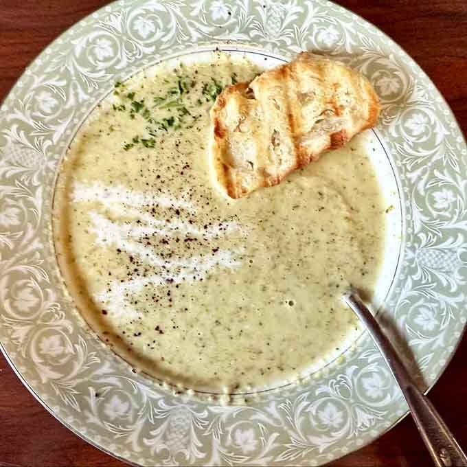 Creamy soup du jour served with perfectly toasted bread makes comfort food feel like a warm hug.