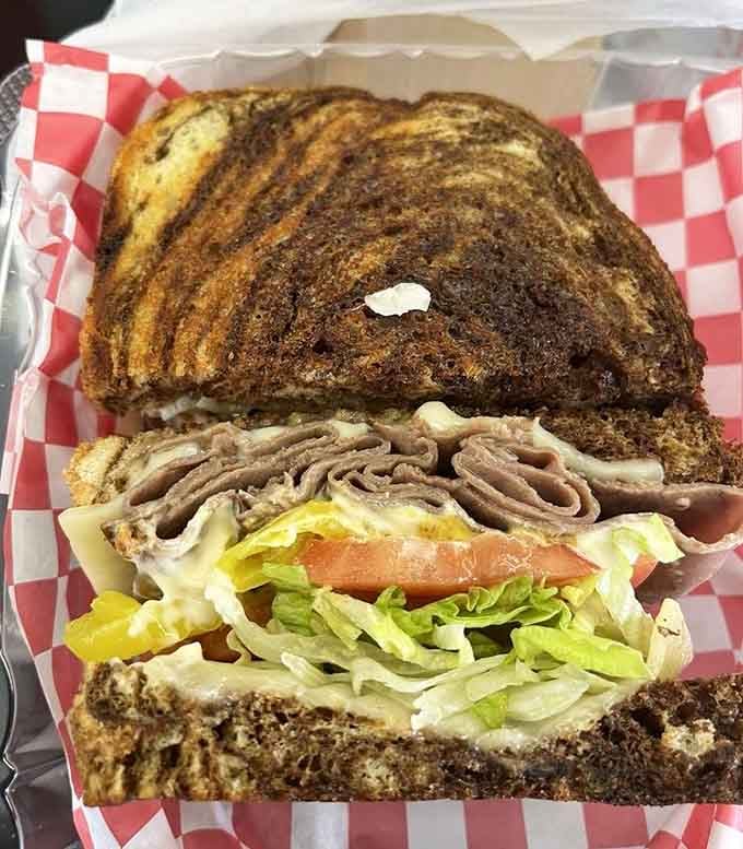 Marbled rye bread embraces tender roast beef in a sandwich that understands the assignment and aces the test.
