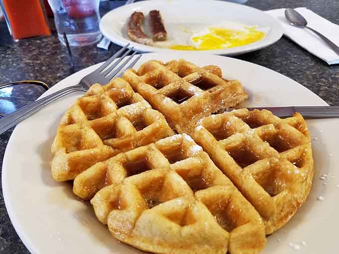 This waffle's crispy grid pattern holds syrup better than most people hold onto New Year's resolutions.