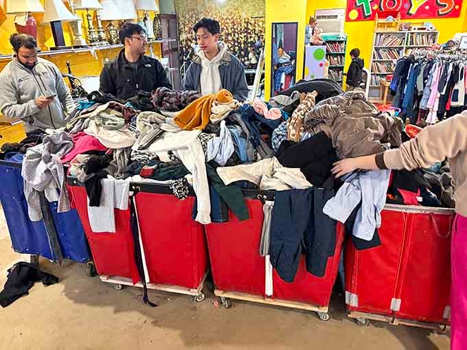 Bargain bins overflow with possibilities, where determined shoppers dig for gold among the gently worn garments and hidden treasures.