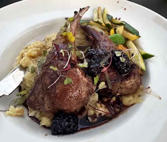 Tender lamb chops nestled in creamy mash with a berry reduction that would make Julia Child smile approvingly.