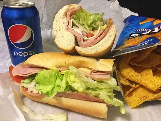 This sub is stacked higher than your expectations, with fresh lettuce cascading like a delicious green waterfall of crunch.