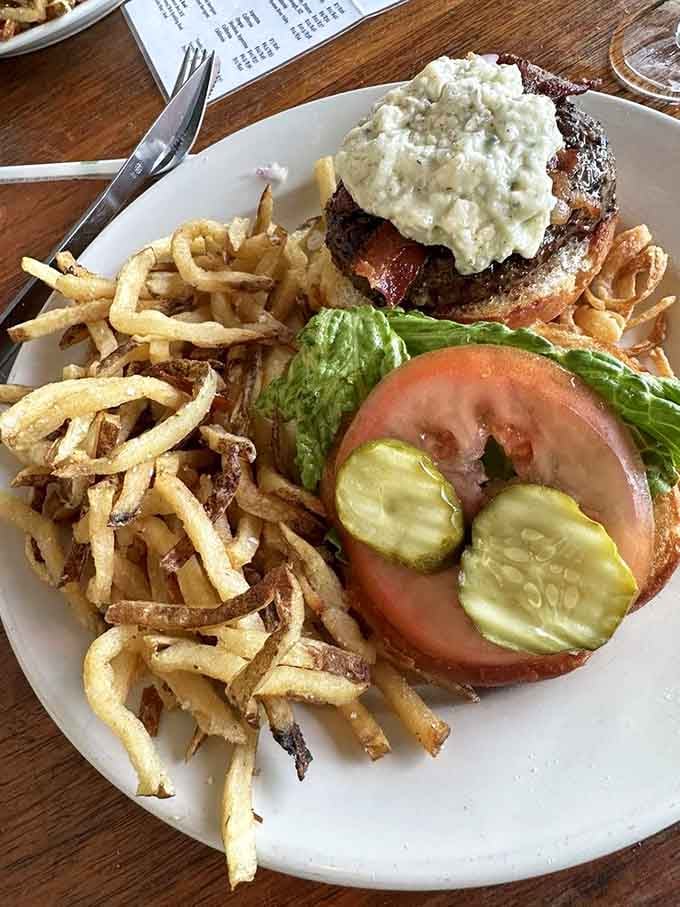 Blue cheese cascades over bacon like a delicious avalanche you absolutely want to be caught in today.