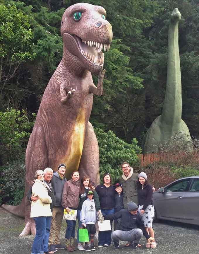Nothing says "family photo opportunity" quite like posing with a grinning T-rex that's seen some things.