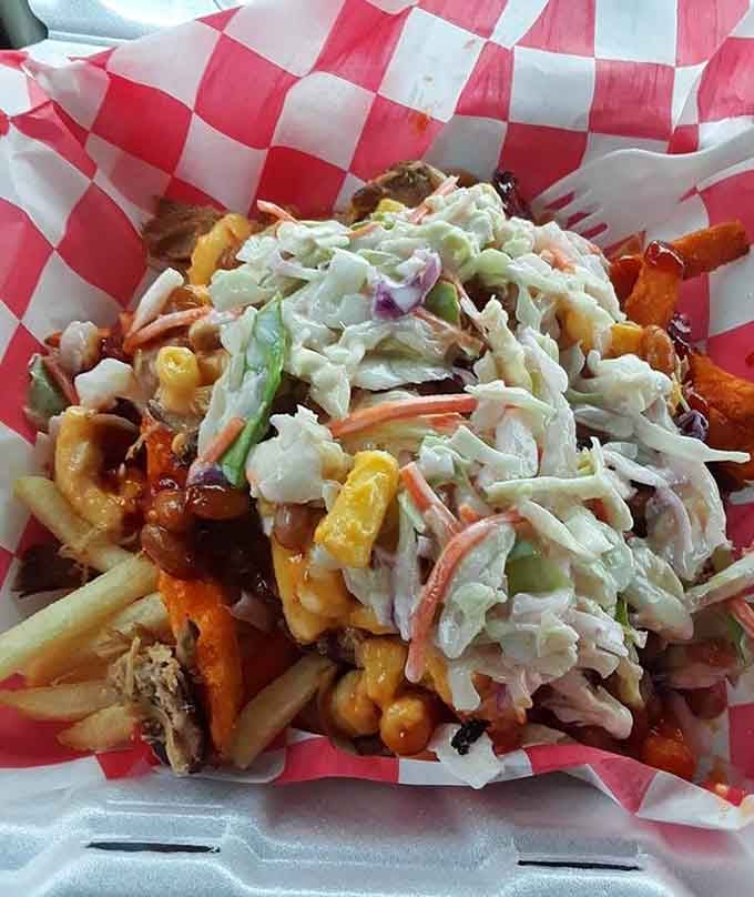 The Hillbilly Fries: waffle fries buried under pulled pork, mac and cheese, proving excess is underrated.