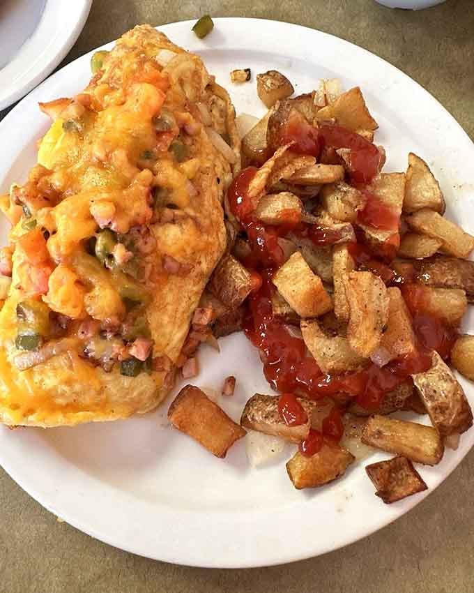 Golden hash browns meet a Western omelette in what might be the perfect marriage of breakfast flavors.