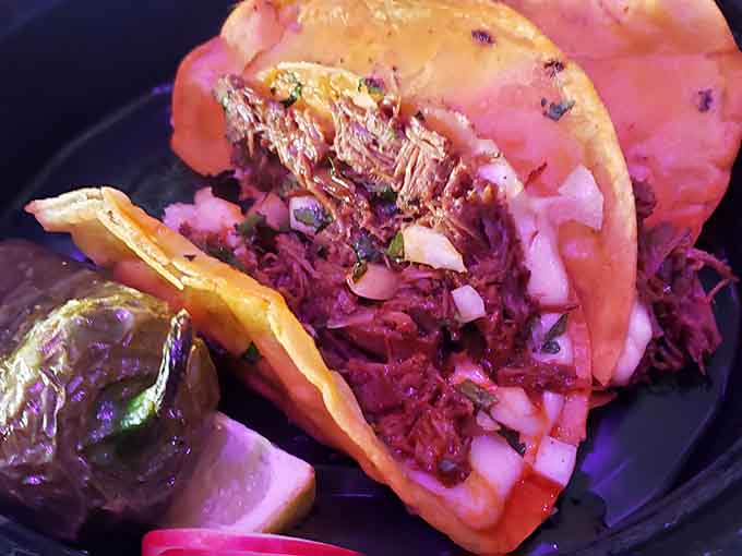 Tender pulled meat piled high in a soft bun, because even arcade champions need proper fuel between rounds.
