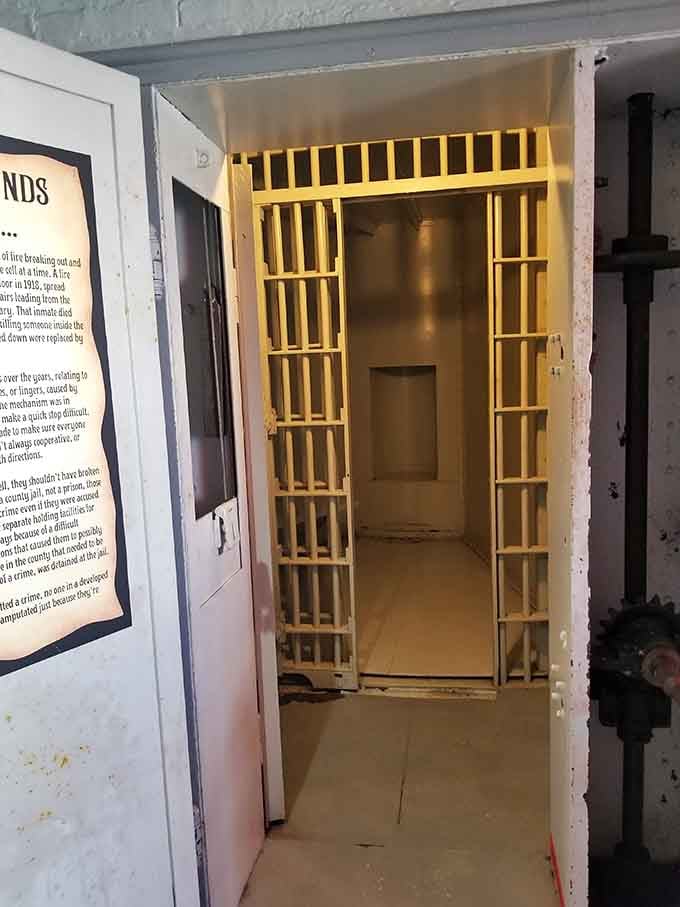 Yellow bars frame a view into cramped quarters where prisoners lived on history's strangest carnival ride.