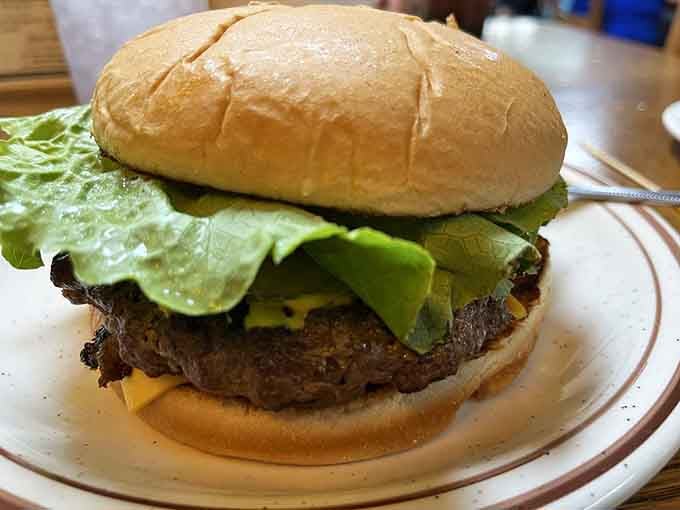 A burger so perfectly constructed it deserves its own architectural award and immediate consumption.