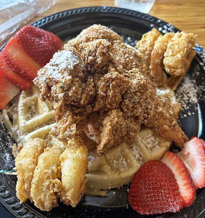 Crispy fried chicken meets fluffy waffles with shrimp joining the party, because why should dinner have all the fun here?