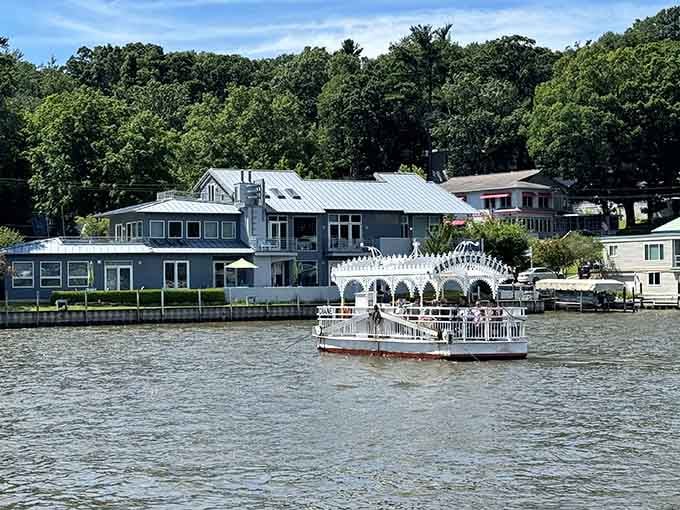 That paddlewheel boat gliding past waterfront homes is your reminder that life moves slower near the water.