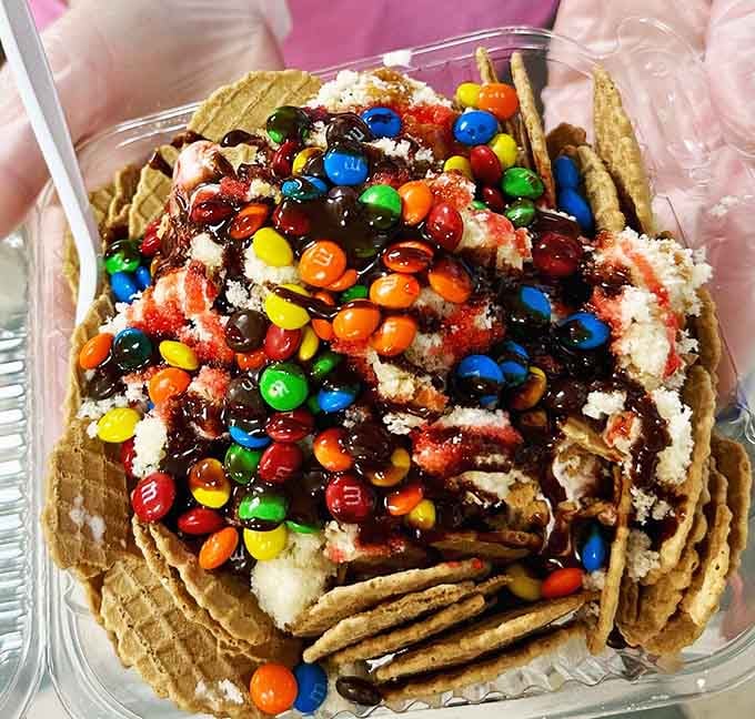 M&Ms scattered across ice cream nachos like edible confetti, because subtlety is overrated when dessert's involved here.