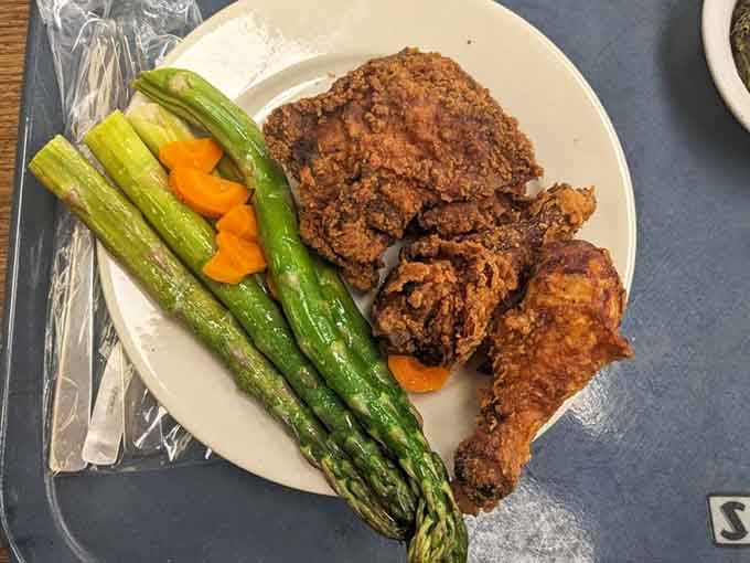 Golden fried chicken with fresh vegetables, because sometimes you need comfort food that actually cares about you.