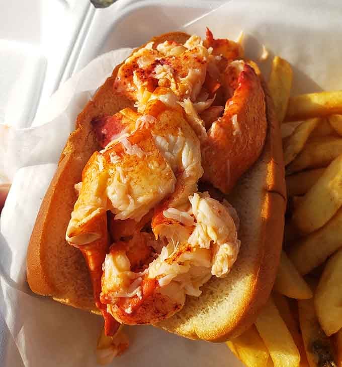 Fresh lobster meat piled high on a butter-grilled roll, because Massachusetts knows exactly what it's doing here.